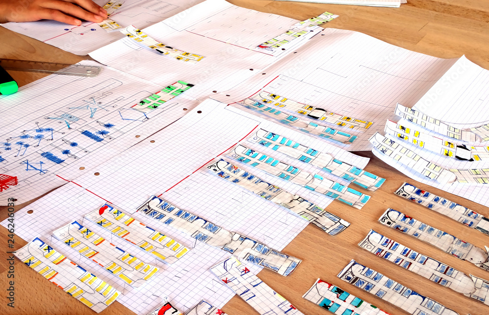 Kid presenting his project of technical drawings. German articulated ...