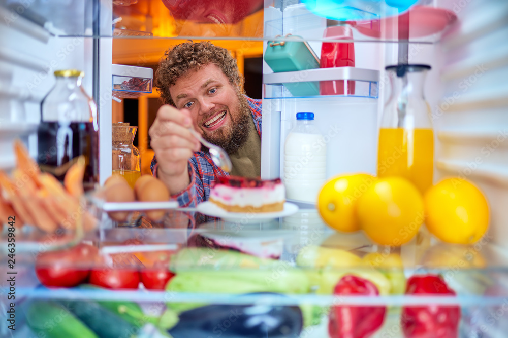 Man eating cheesecake. Unhealthy eating concept. Picture taken from the ...