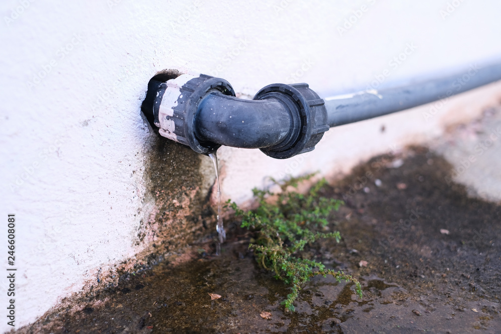 Water leakage from old pipe. Stock Photo | Adobe Stock