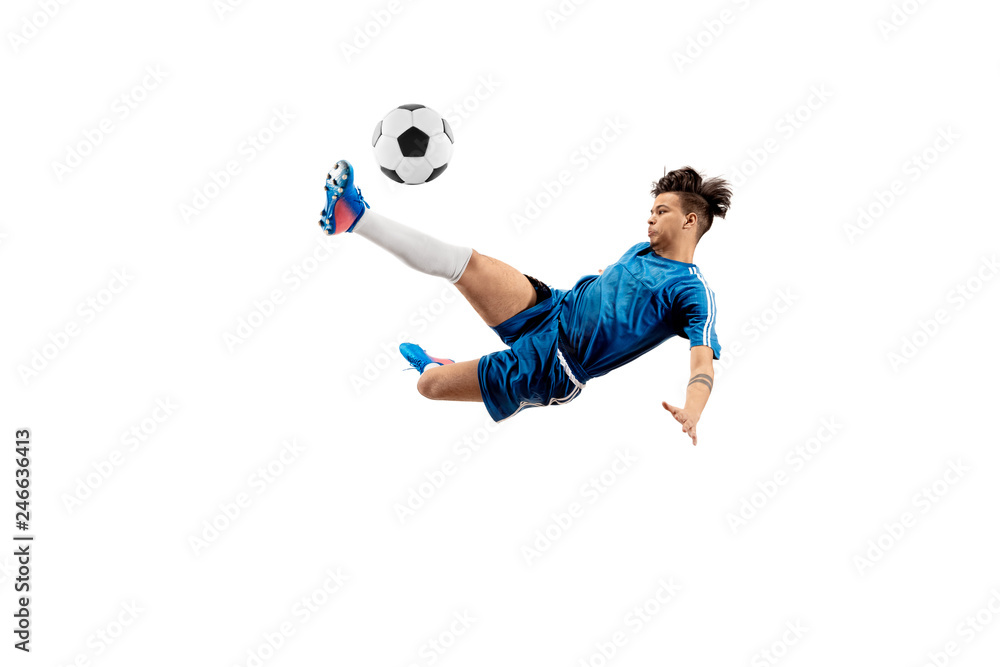Young boy with soccer ball doing flying kick, isolated on white ...