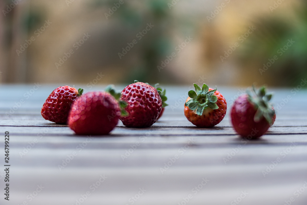 solated strawberries. Falling strawberry fruits whole and cut in half ...