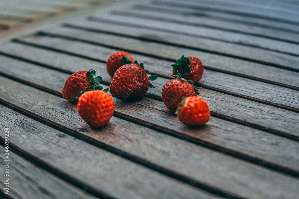 solated strawberries. Falling strawberry fruits whole and cut in half ...