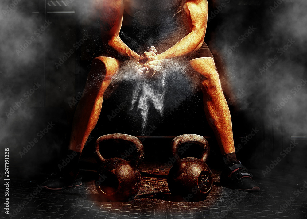 Weightlifter clapping hands and preparing for workout at a gym Stock ...