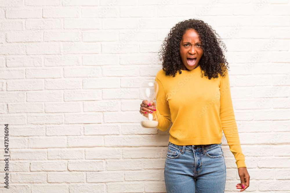 Young black woman screaming angry, expression of madness and mental ...