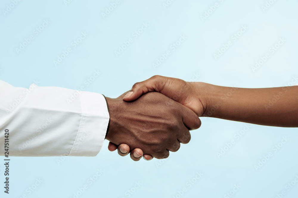 The female and male hands of afro american doctors at studio. The ...