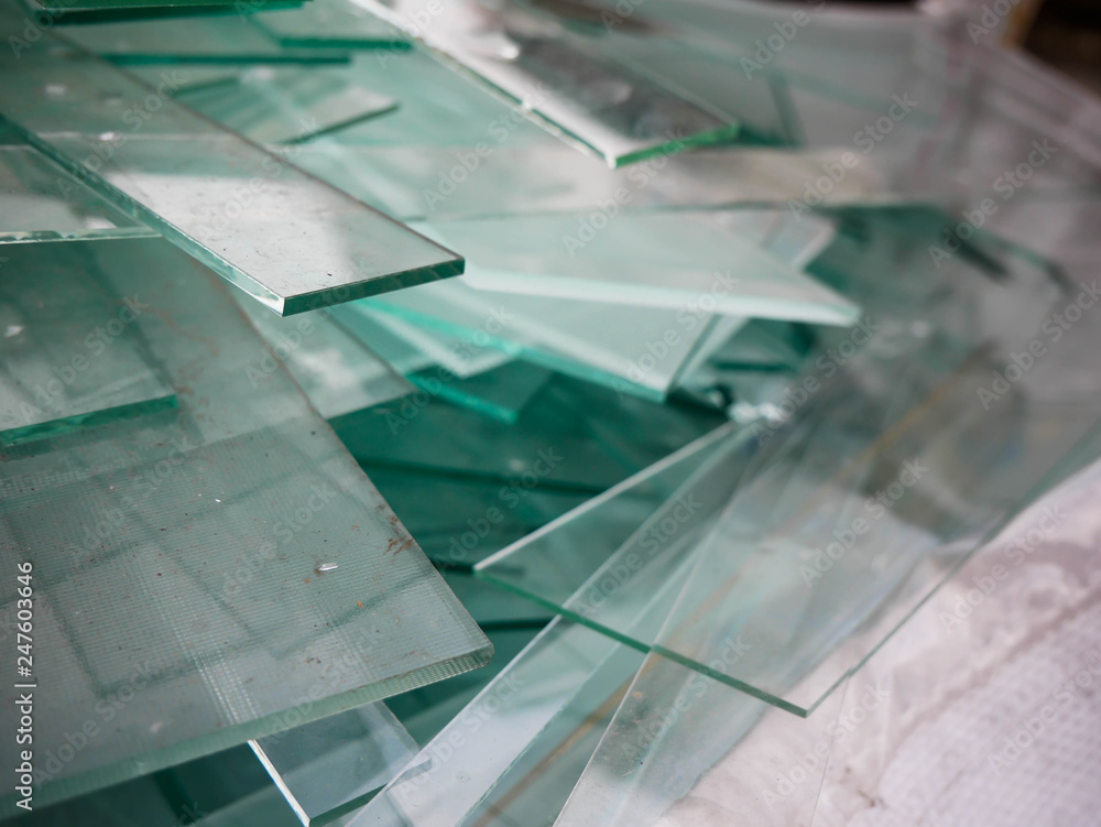 Sheet glass waste in big white plastic bags , waiting the transport ...