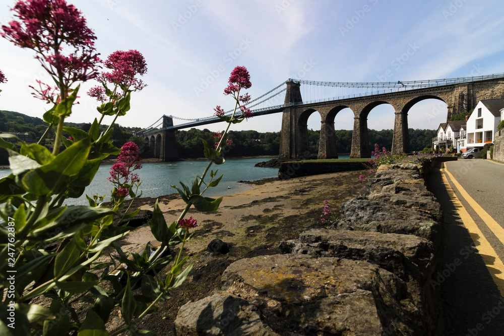 Beautiful vista of the historic Menai Suspension Bridge spanning the ...