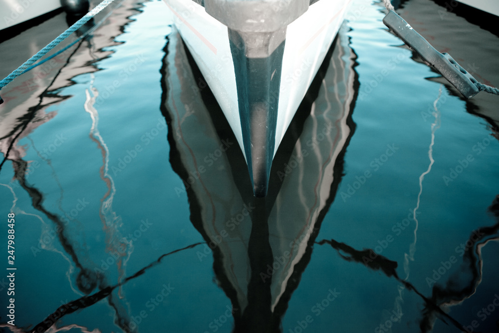 Sailing reflection. Boat hull at the port reflecting symmetrical in the ...