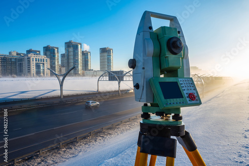 Theodolite. Surveying equipment. Theodolite stands on a tripod ...