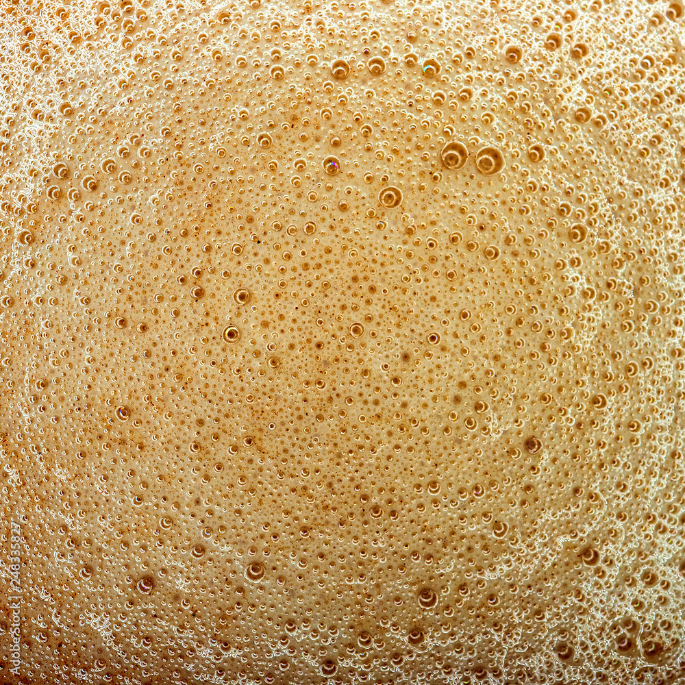 Hot coffee drink cappuccino or latte close up macro foam texture. View ...