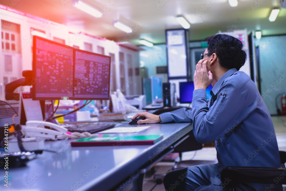 Blurred of man engineer works with the tablet in the production control ...