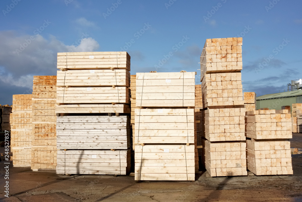 Wood chips pellets chopped wooden logsand stacked wooden pallets for ...