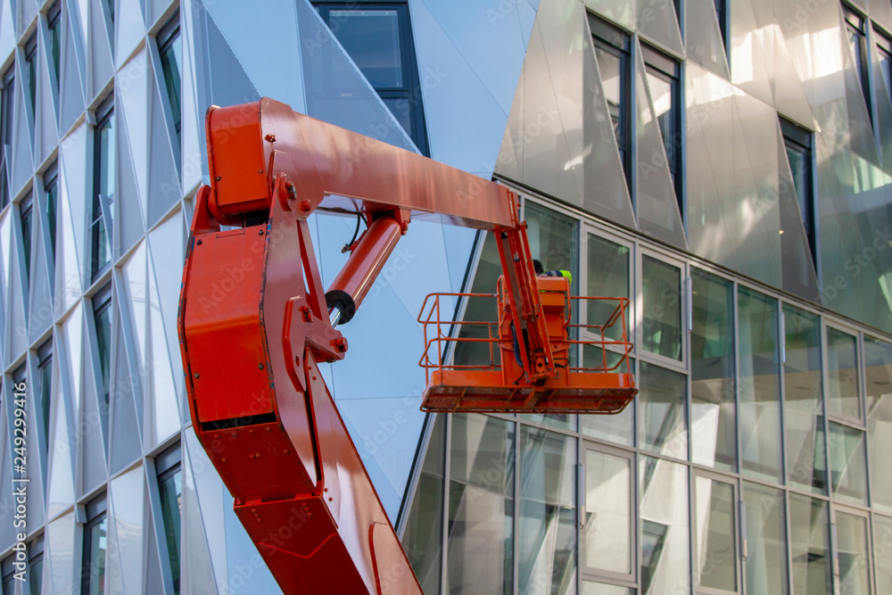 lift with a man install and service a new building Stock Photo | Adobe ...