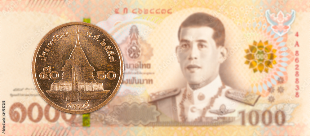 50 thai satang coin against 1000 new thai baht banknote Stock Photo ...