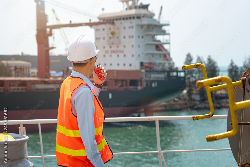 harbor master port control in command the ship to takes berthing to ...