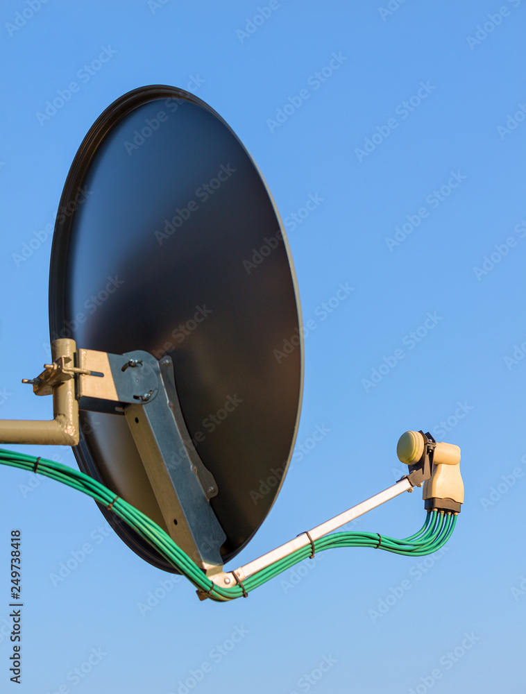 Residential TV receiver satellite dish with low-noise block ...