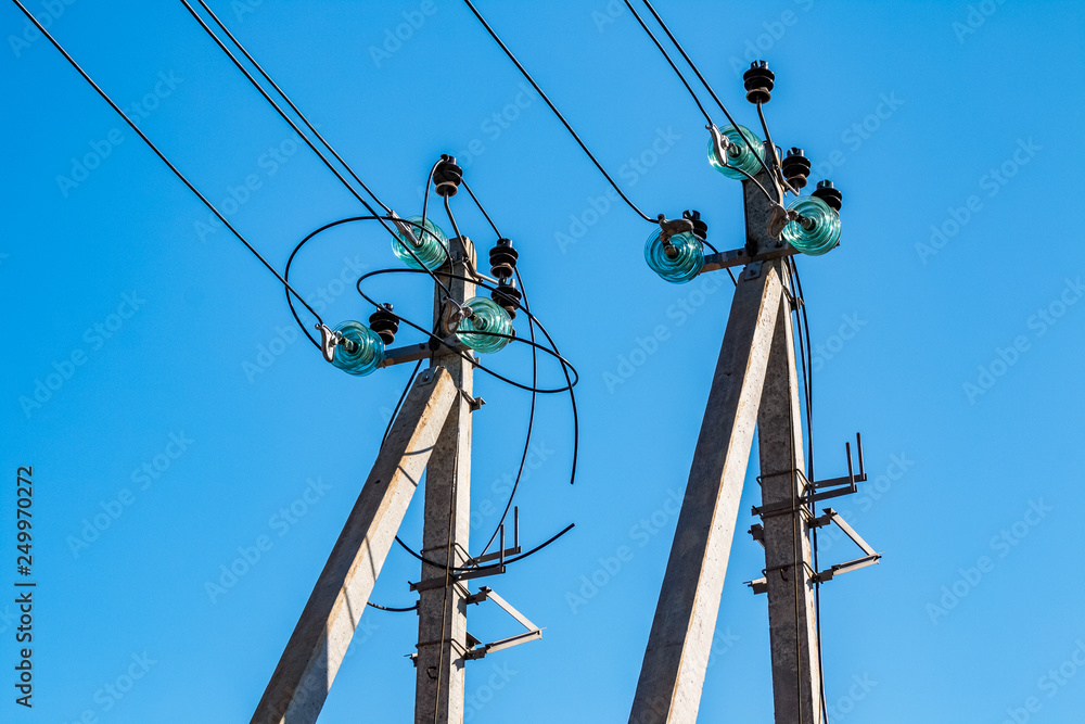 Concrete poles with electrical wires and high-voltage distribution ...