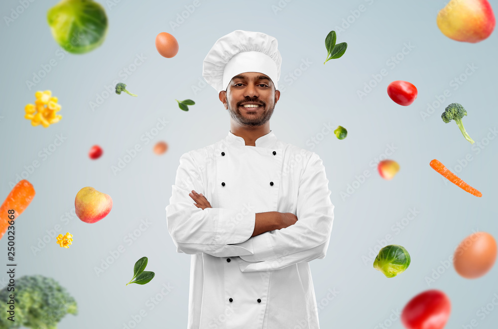 cooking, profession and healthy eating concept - happy male indian chef ...