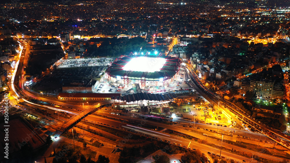 Aerial drone photo of famous illuminated football stadium of Karaiskaki ...