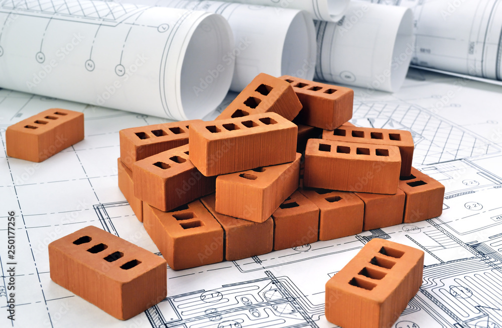 Bricks for building a house with design drawings Stock Photo | Adobe Stock