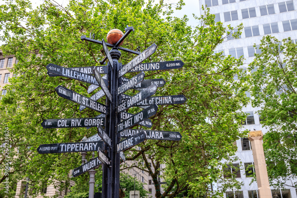 Famous signpost of directions to world landmarks at Pioneer Courthouse ...