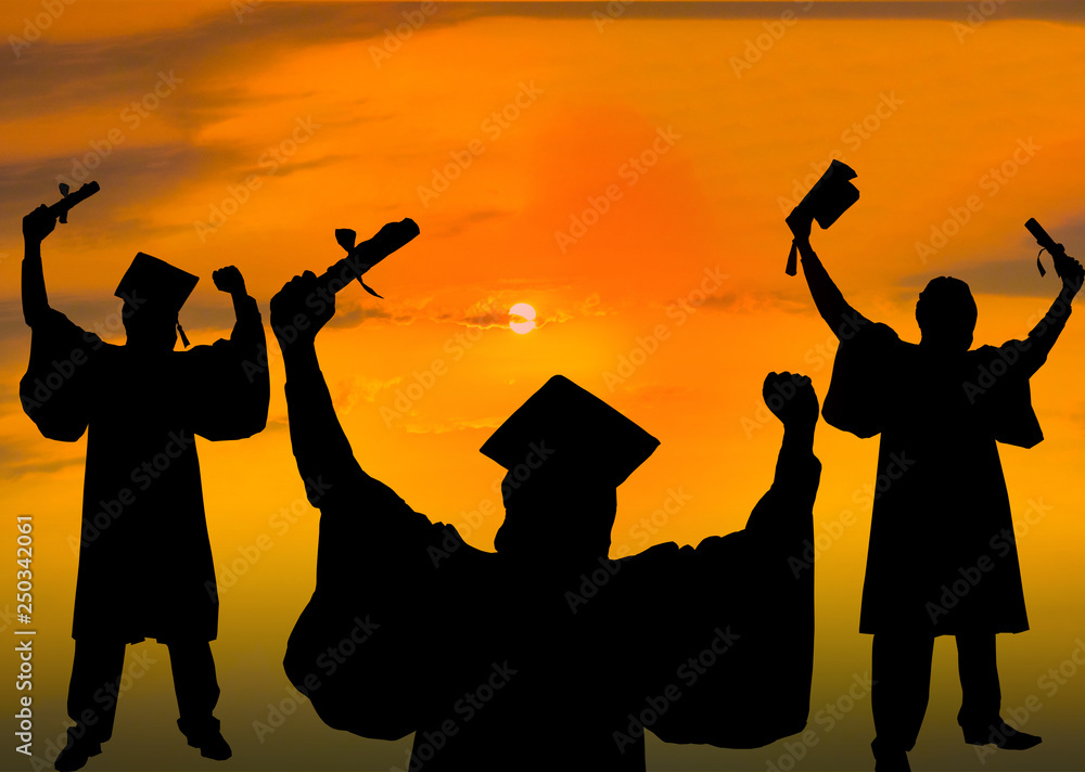 Silhouette of Student Graduation. They are seeing sunset. They are ...