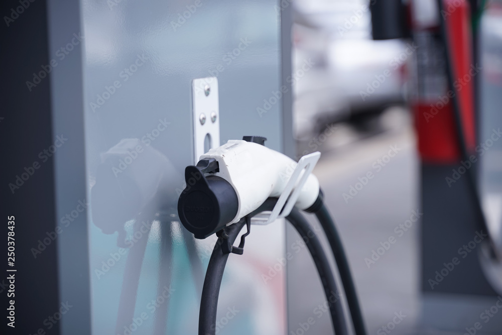 electric vehicle charging (Ev) station with plug of power cable supply for Ev car. Smart enegy ...
