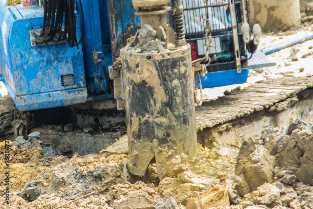 Hydraulic drilling machine is boring holes in the construction site for ...