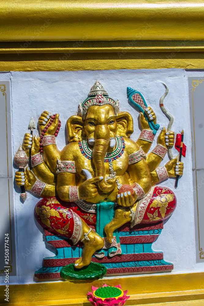 Colorful Ganesha Hindu god avatar images in stucco low relief white ...