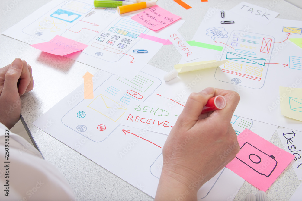 Software developer makes structure app for modern mobile phone. Stock ...