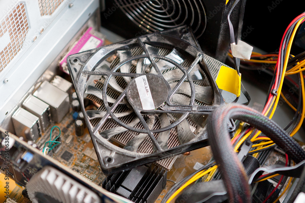 dusty desktop pc hardware. motherboard and another computer elements ...