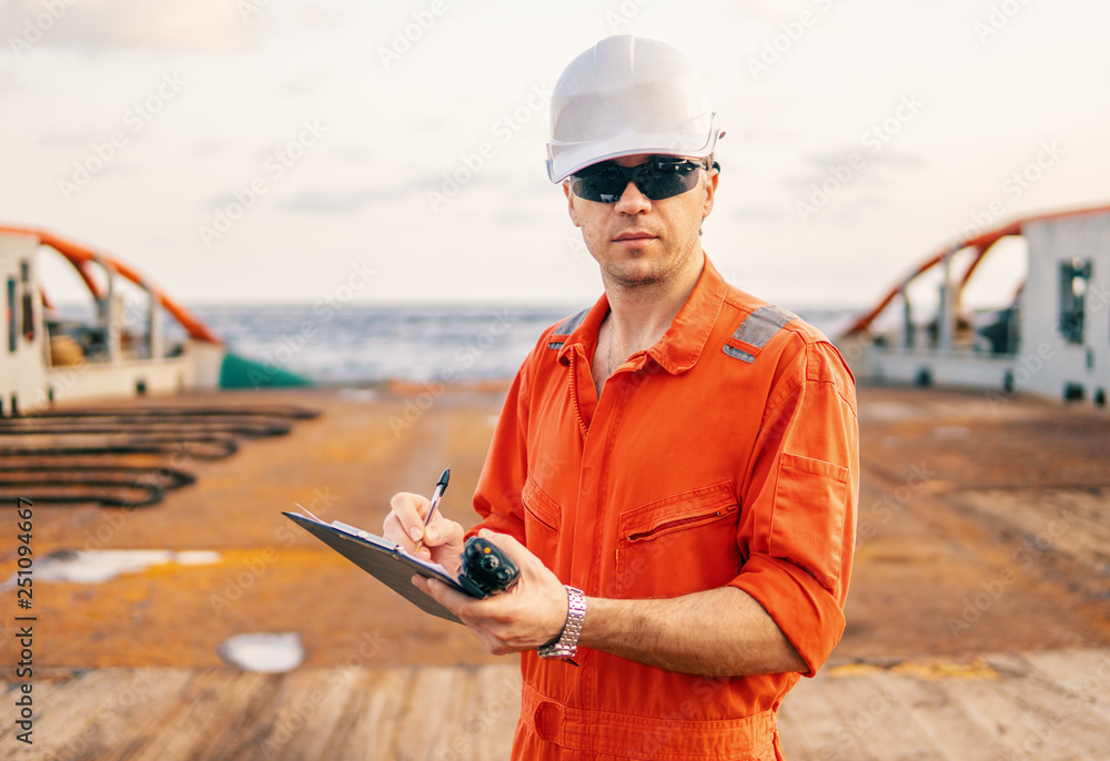 Marine chief officer or chief mate on deck of ship or vessel. He fills ...