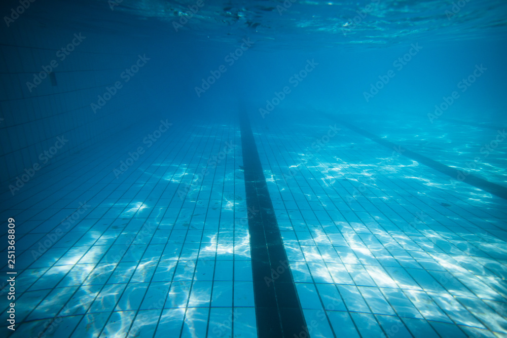 Wide angle underwater photo inside an olympic sized swimming pool with ...