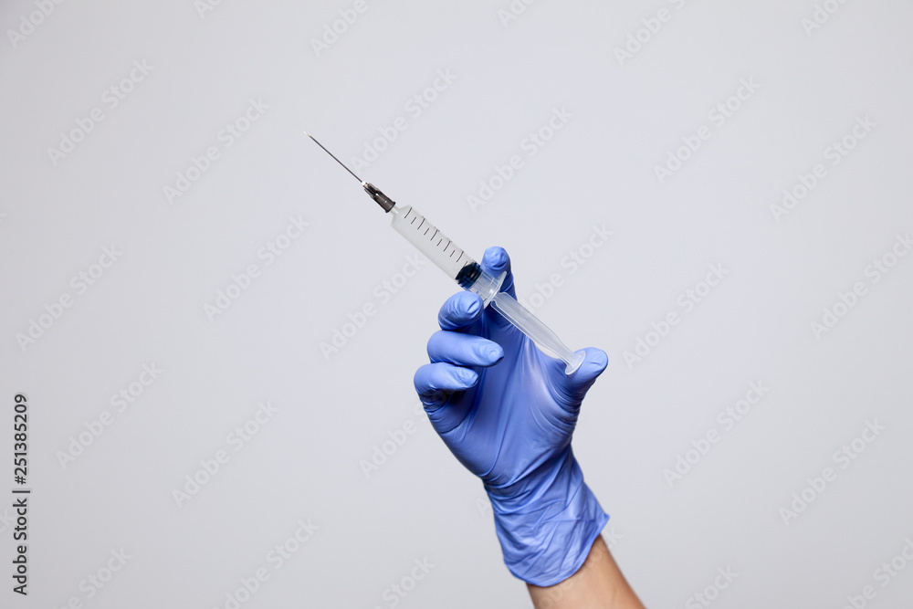 Closeup hand in rubber latex medicine purple glove holding transparent ...