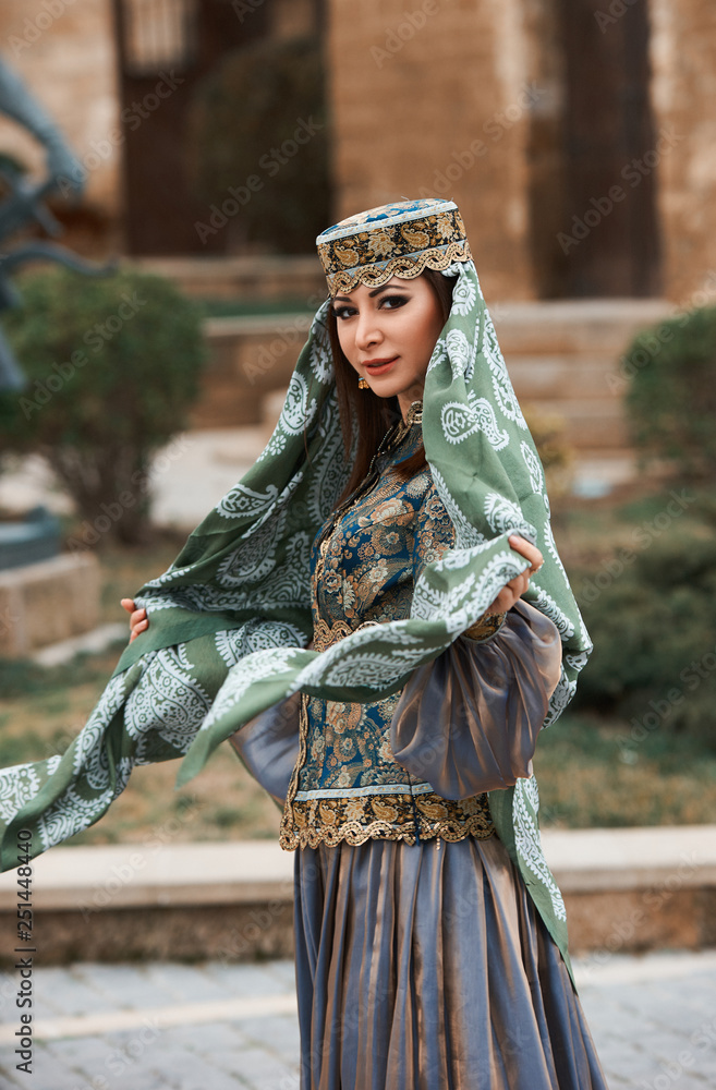 Beautiful woman wearing oriental national clothes posing outdoor Stock ...