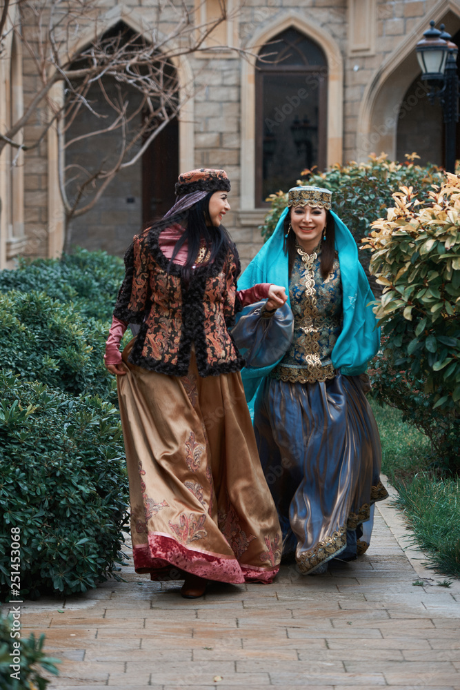 Beautiful azeri women in traditional Azerbaijani dress running by the ...