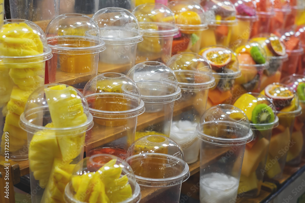 Street food vender selling blend fruit juice with fruits in clear ...