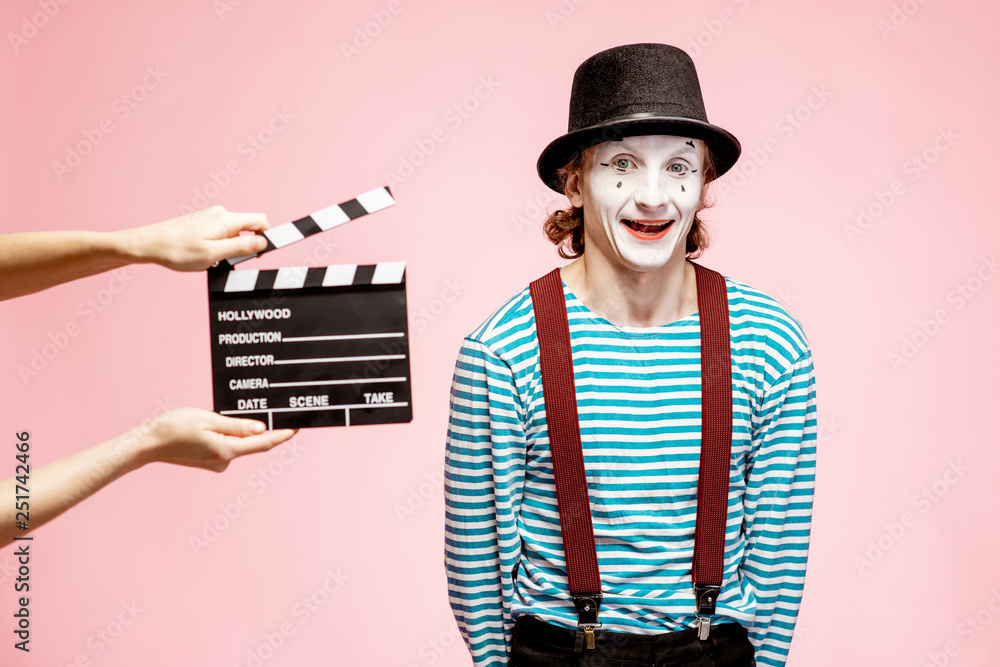 Portrait of an actor as a pantomime with cinematography clapperboard on ...