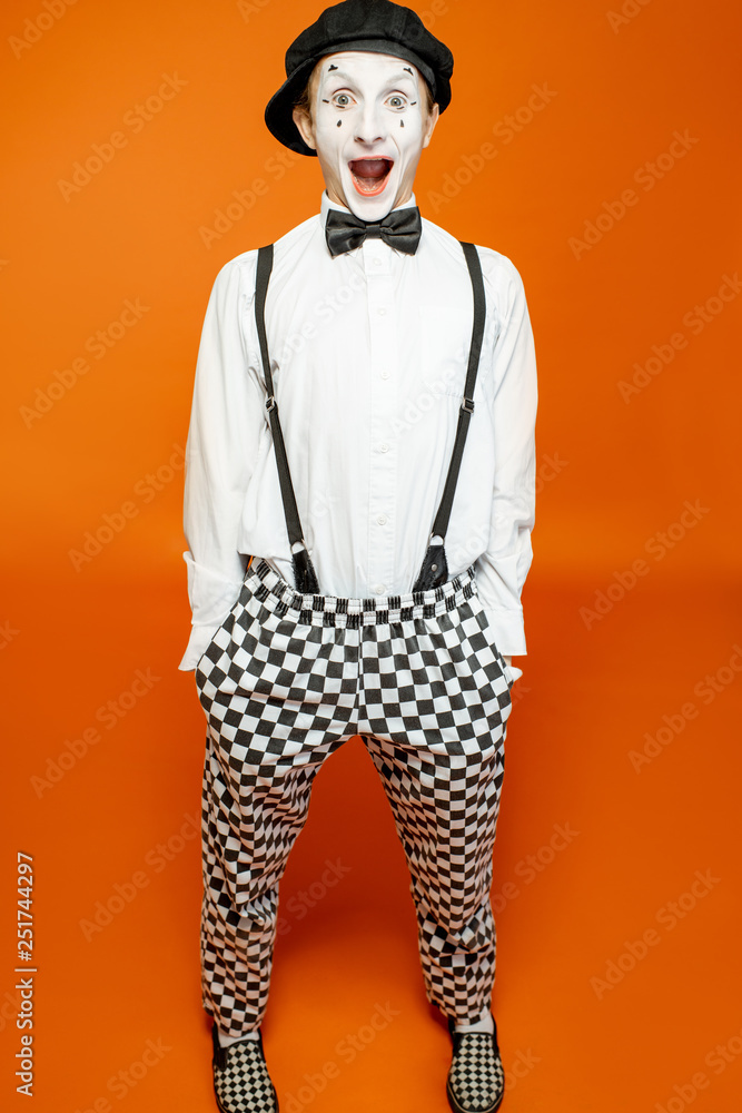 Full length portrait of an actor as a pantomime with white facial ...