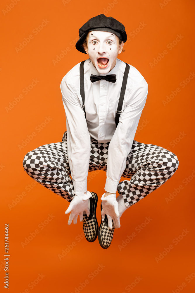 Portrait of an actor as a pantomime with white facial makeup showing ...