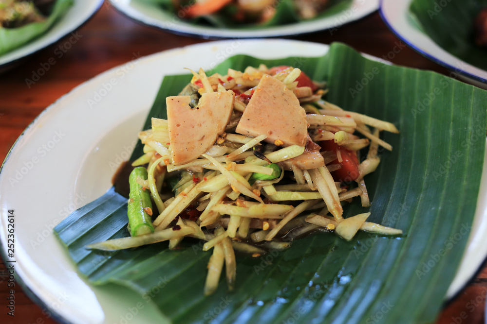 Spicy papaya salad with vietnamese pork sausage Thai traditional food ...
