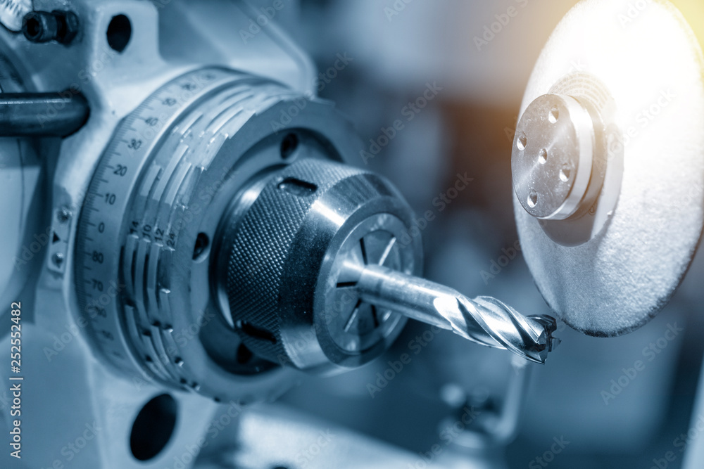 The operation of tool making machine control by computer program. The ...