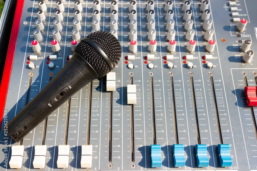 Close up Microphone on Mixing Console of a big HiFi system, The audio ...