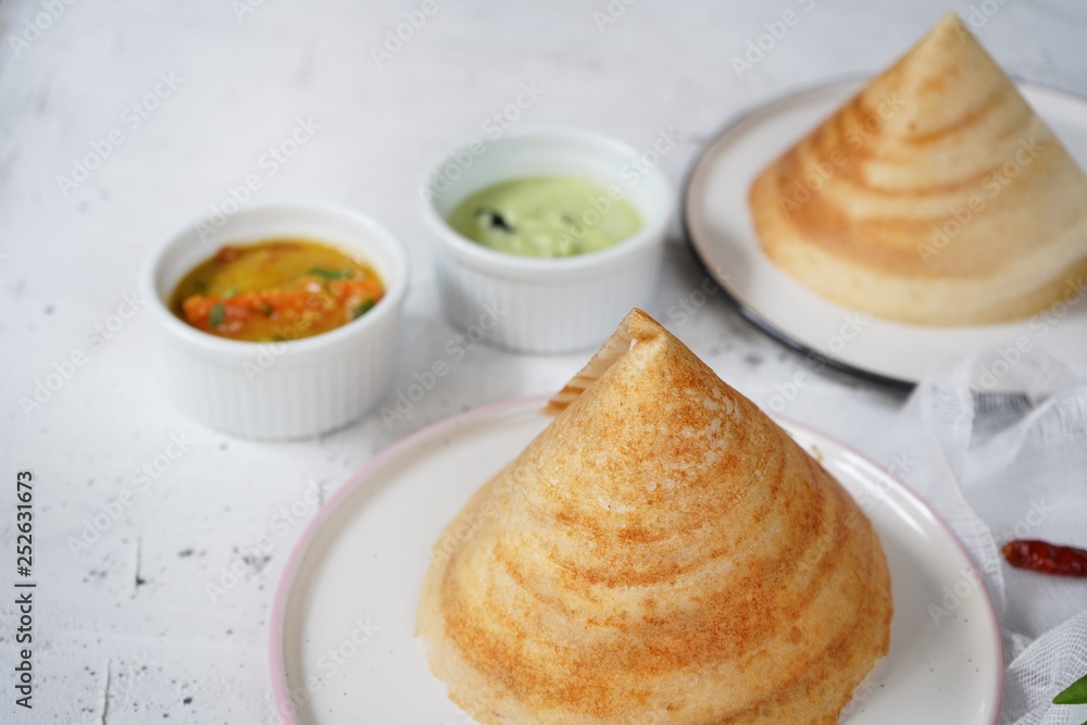 South Indian breakfast cone shaped dosa Idli sambar and chtney ...
