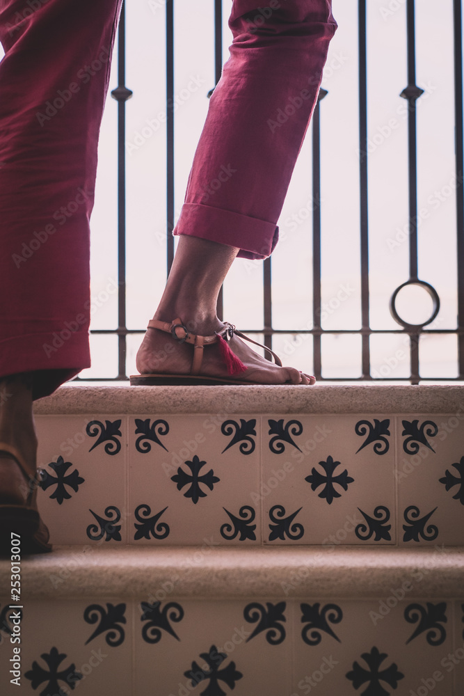 British Indian woman - feet in ethnic footwear with cymbals and tassel ...