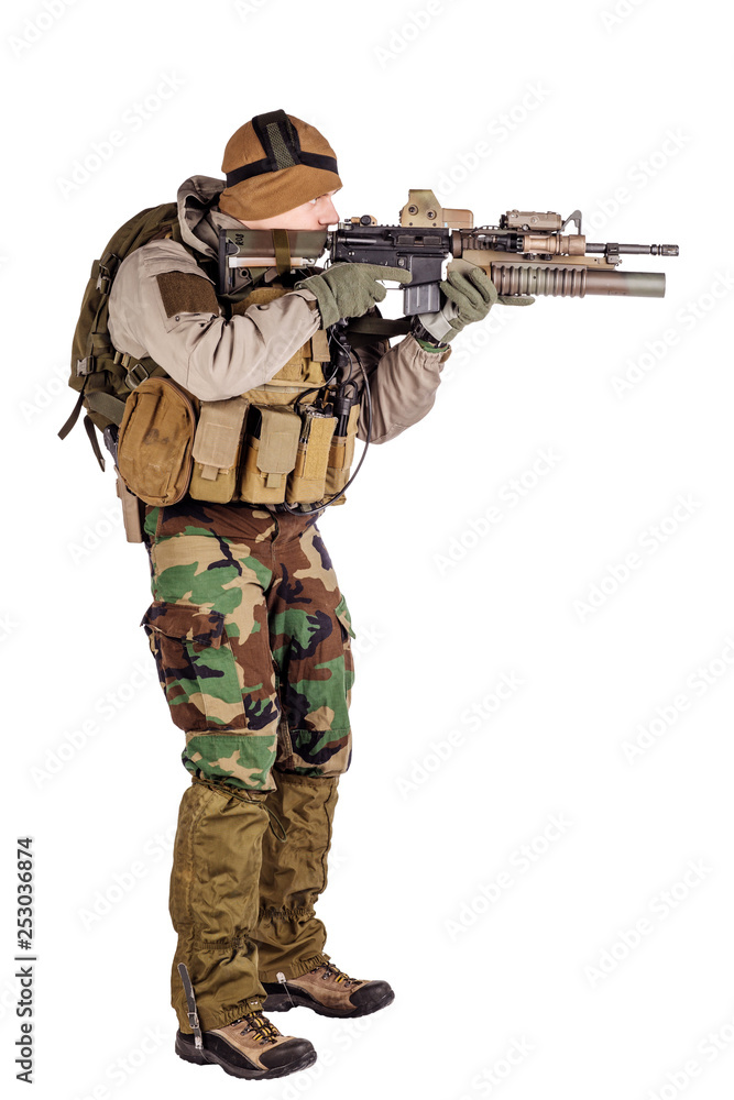 Portrait soldier or private military contractor holding automatic rifle ...