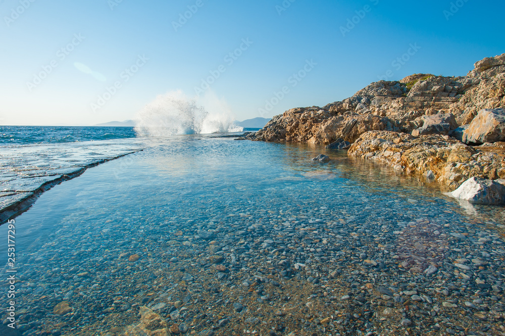 Waves hit the hard surface of concrete slabs Stock Photo | Adobe Stock