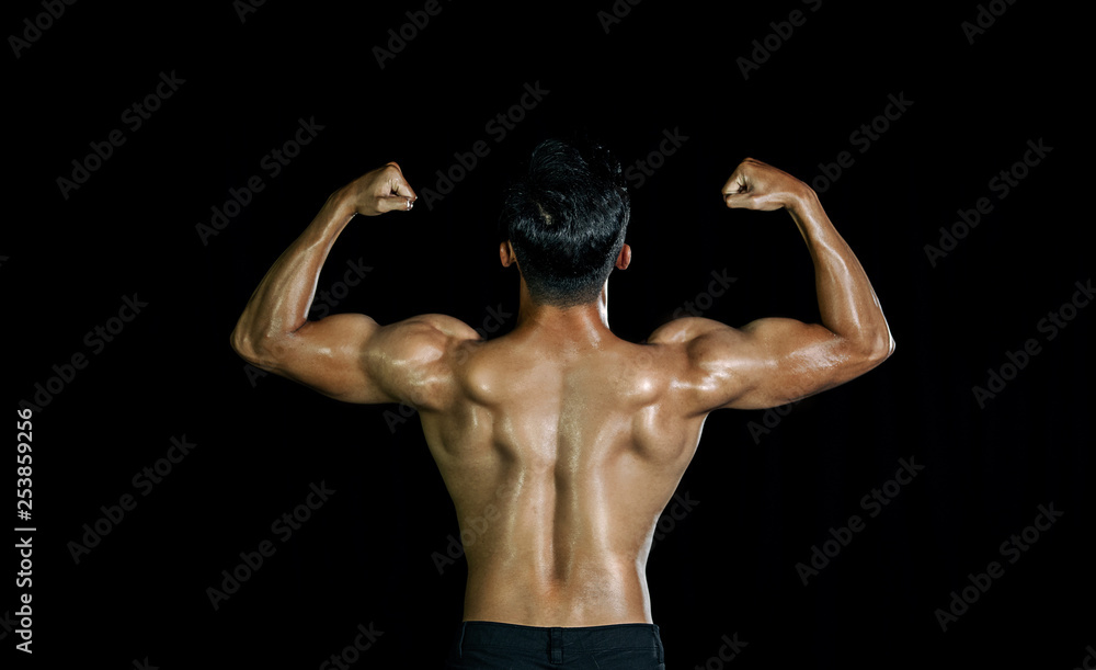 Asian muscle men posing muscle back and shoulder on the black ...