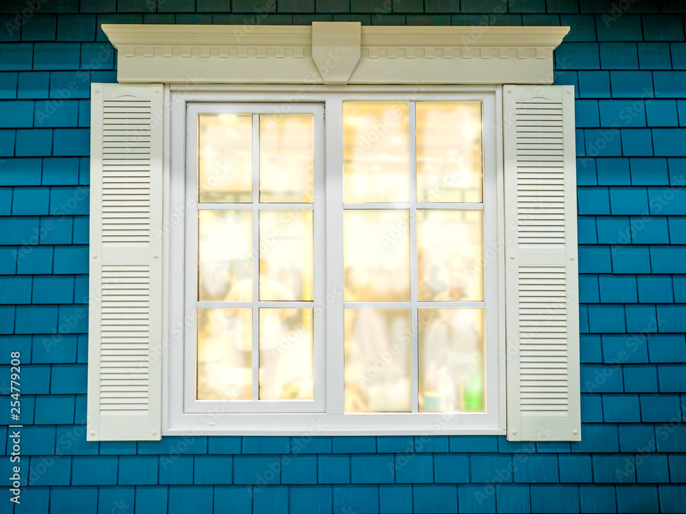 Double casement with platbands. White window in a brick house. Window ...