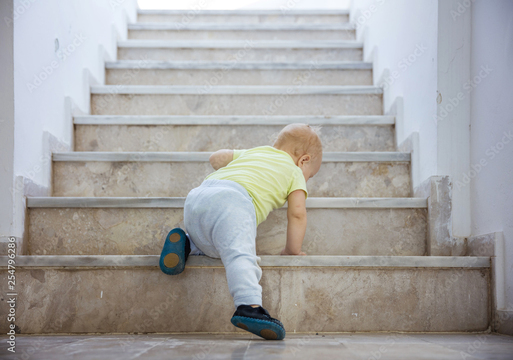 Baby girl crawling up stairs outdoors Stock Photo | Adobe Stock